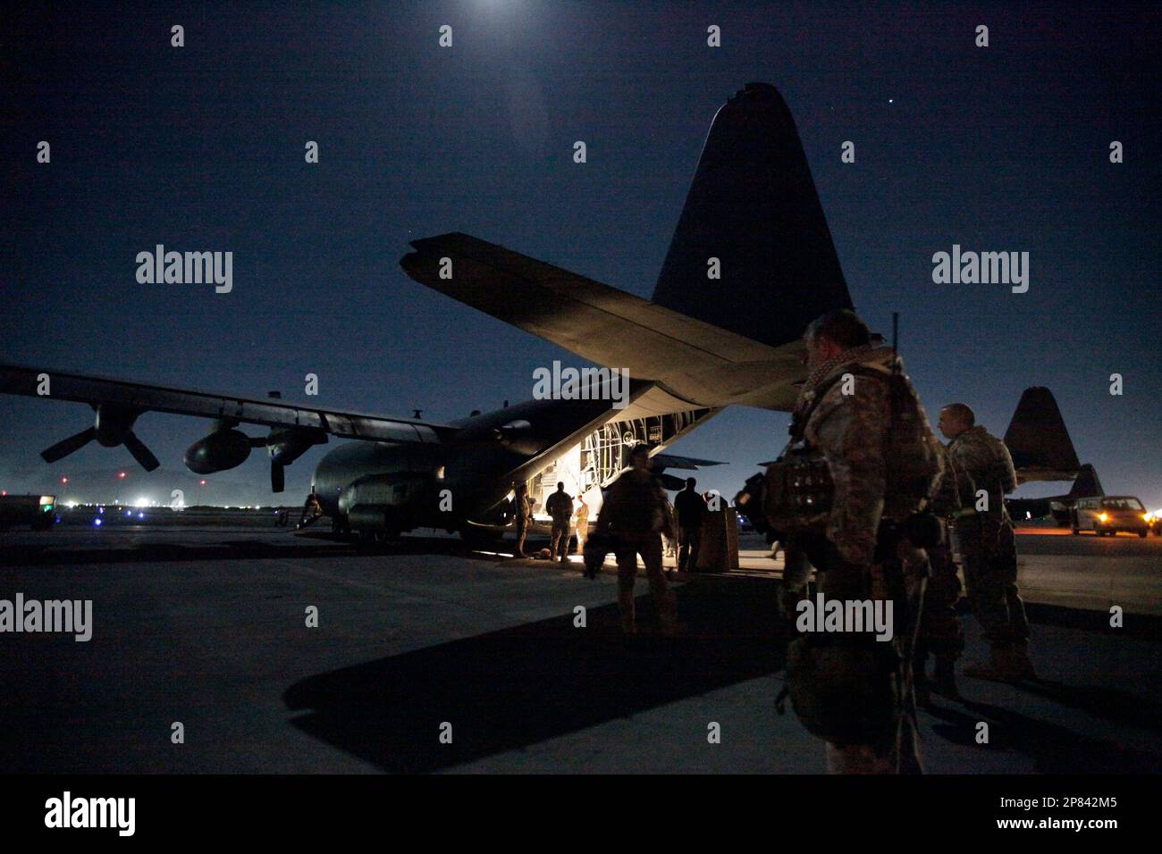 A special operations plane sits on the tarmac as it is readied to fly a ...