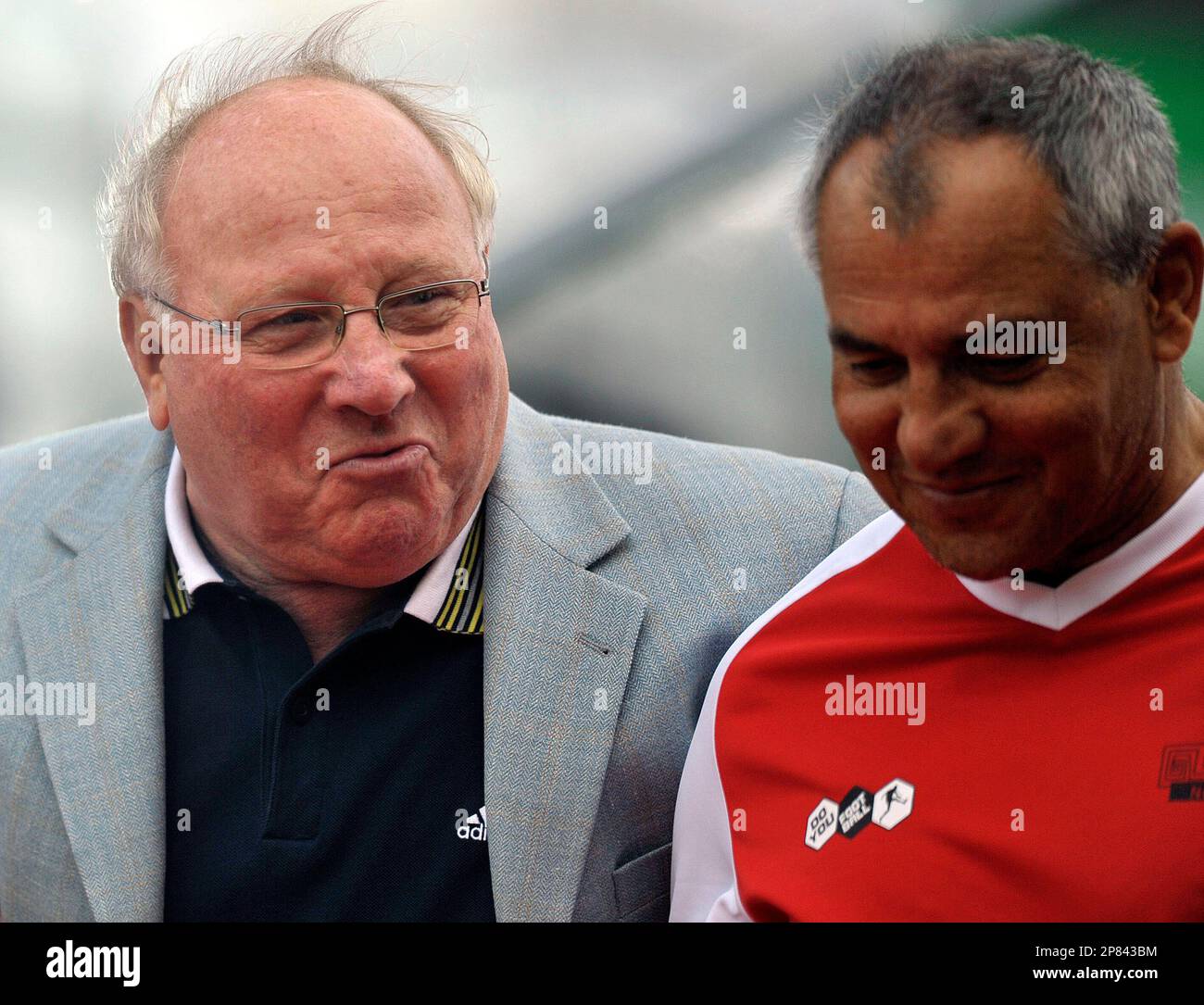 Uwe Seeler, left, and Felix Magath, enter the arena before the German ...