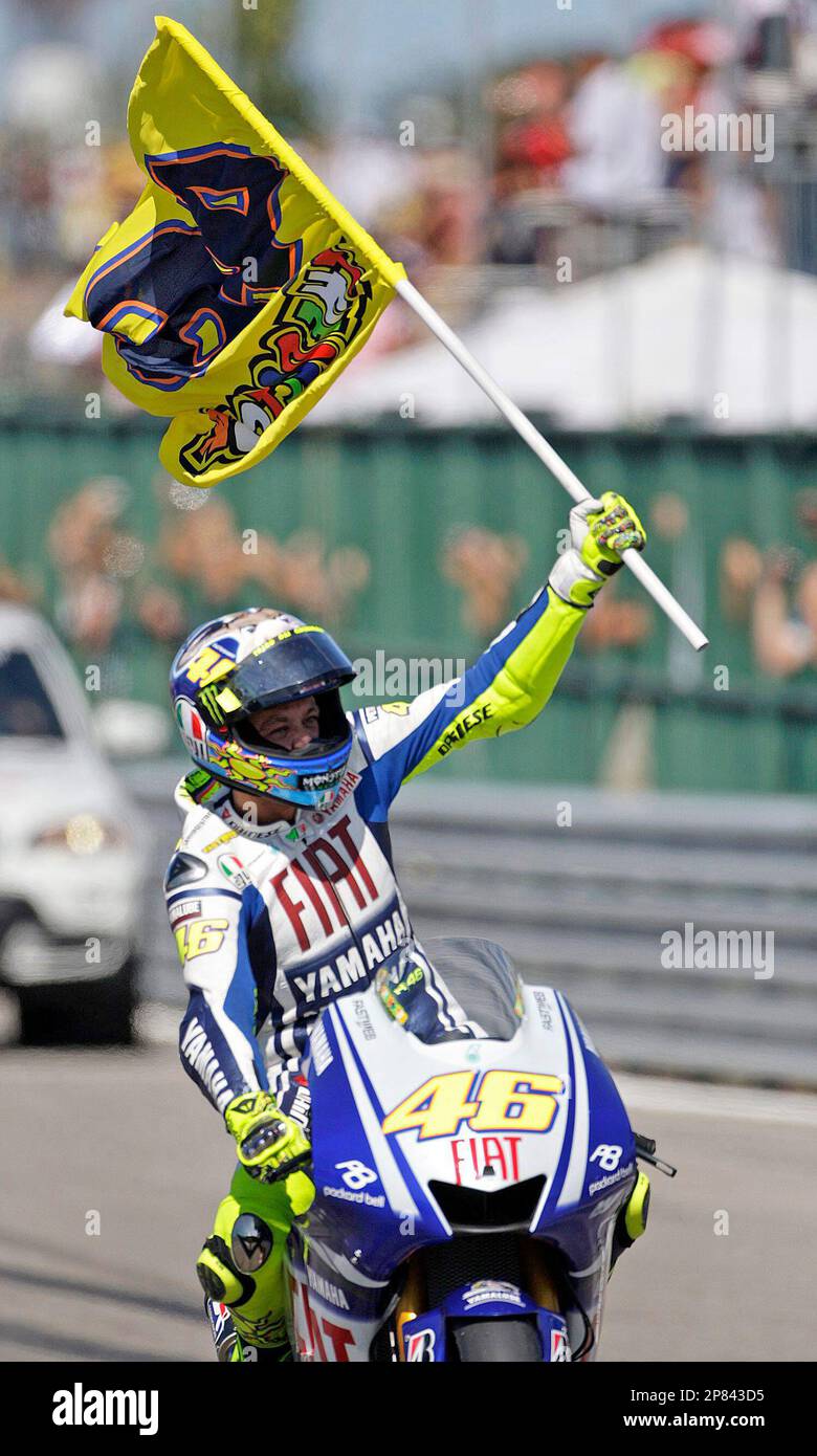 Yamaha's Valentino Rossi, of Italy, celebrates after winning the San ...