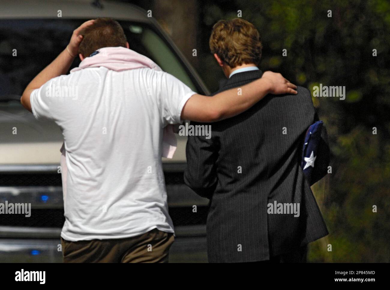 Tyler Heinze, 16, right, the brother of Guy Heinze, Jr., who is charged ...