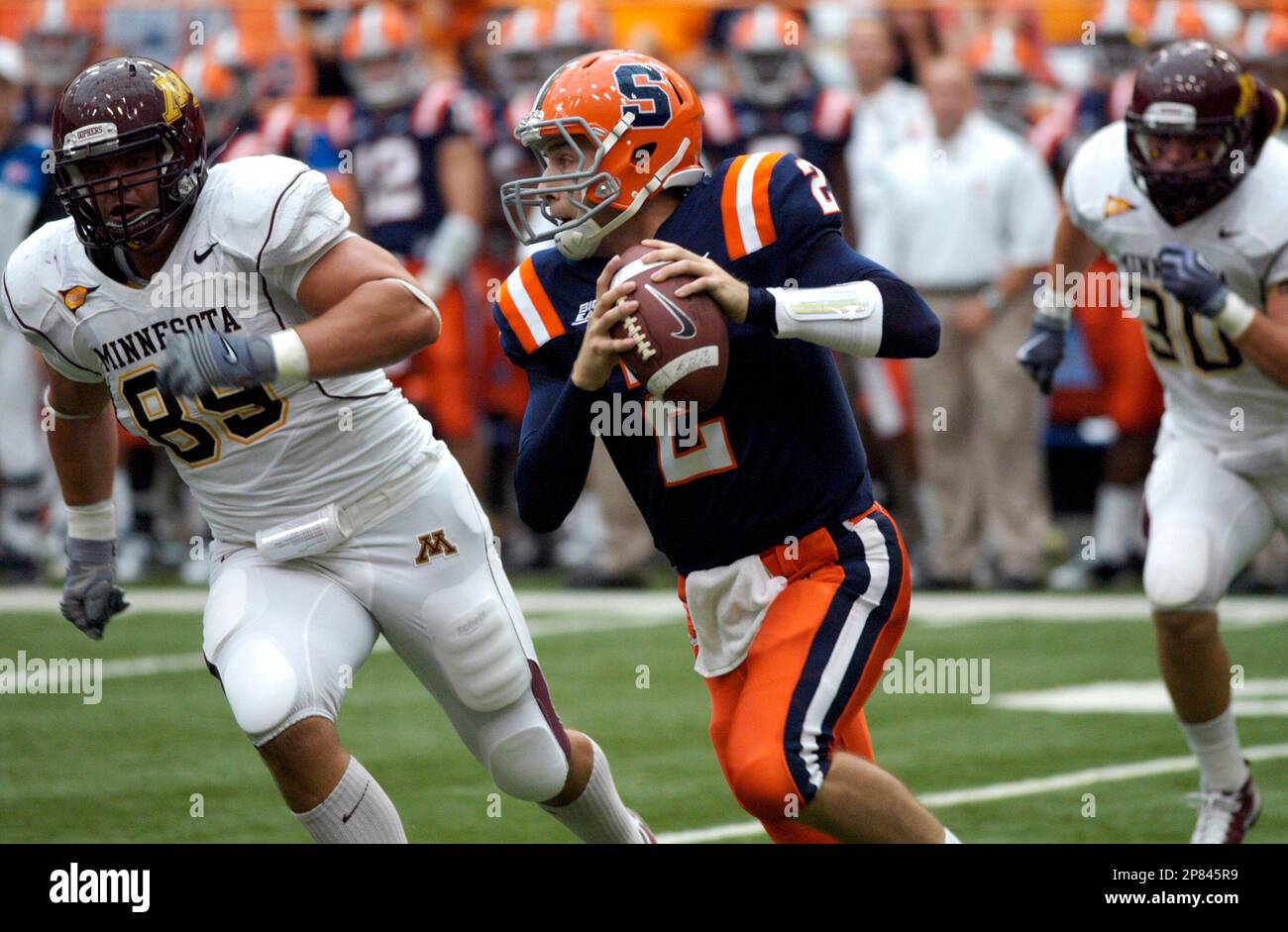 Syracuse quarterback Greg Paulus rolls out under pressure from ...