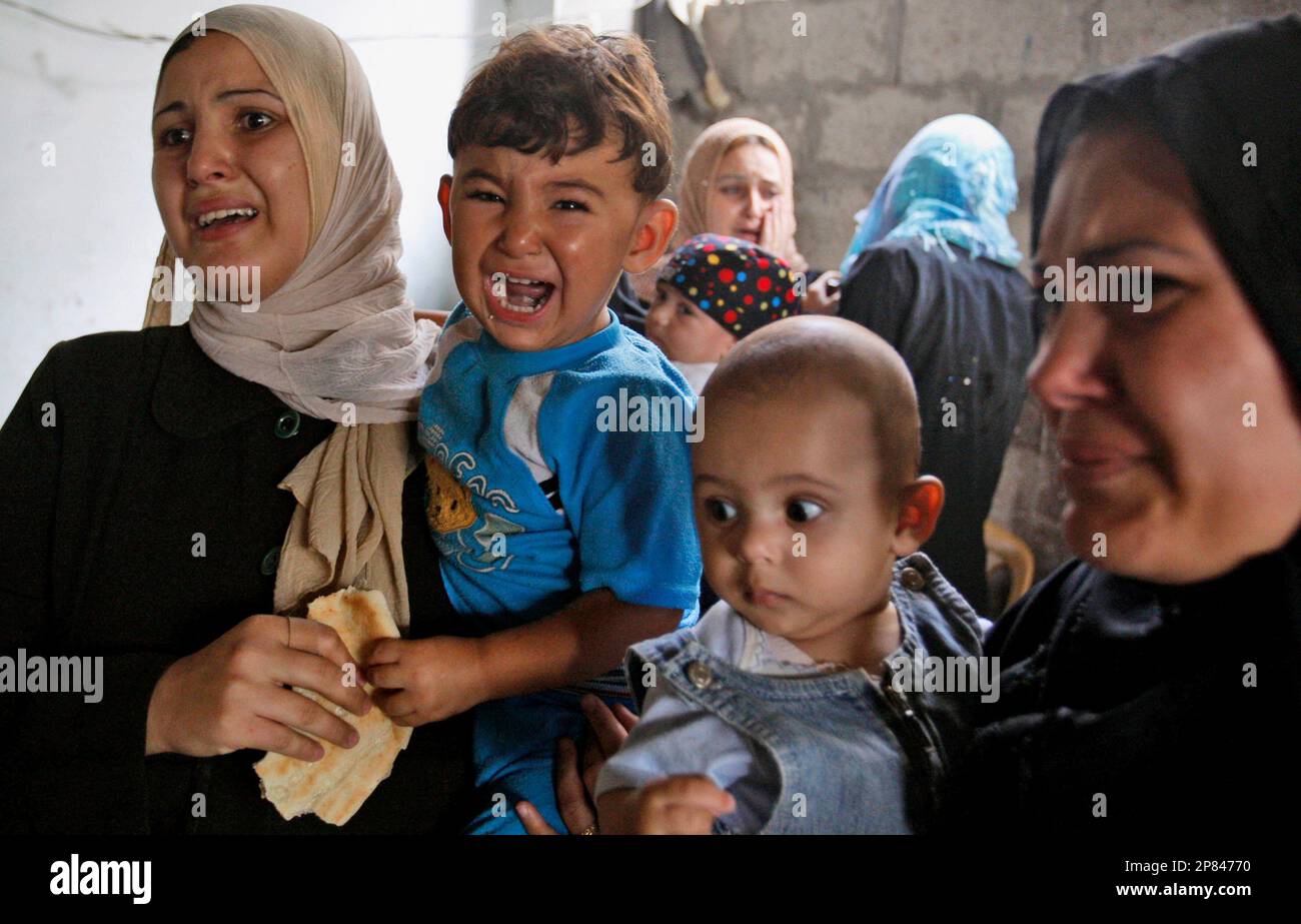 Palestinian relatives of Ghazi Zaneen, 15, react during his funeral in ...