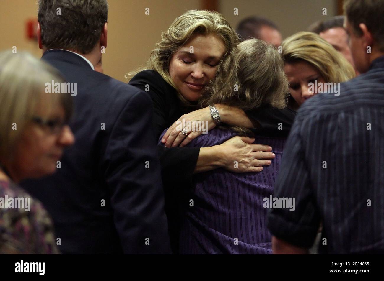 Prosecutor Karen Fraivillig, center, hugs Sue Goff, mother of Denise ...