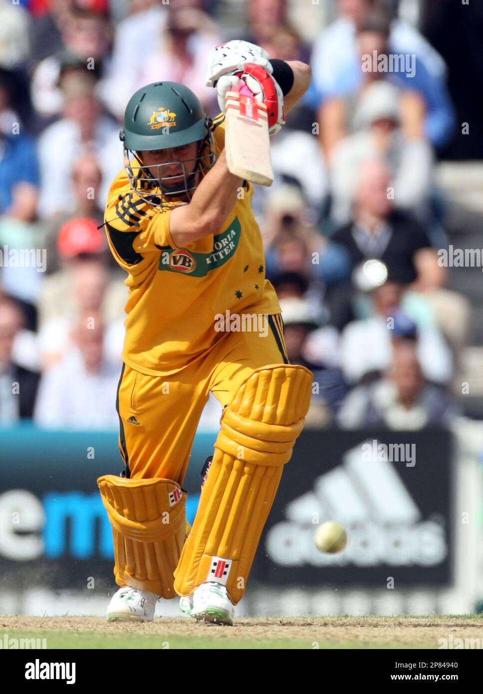 Australia's Callum Ferguson drives a ball from England's Adil Rashid ...