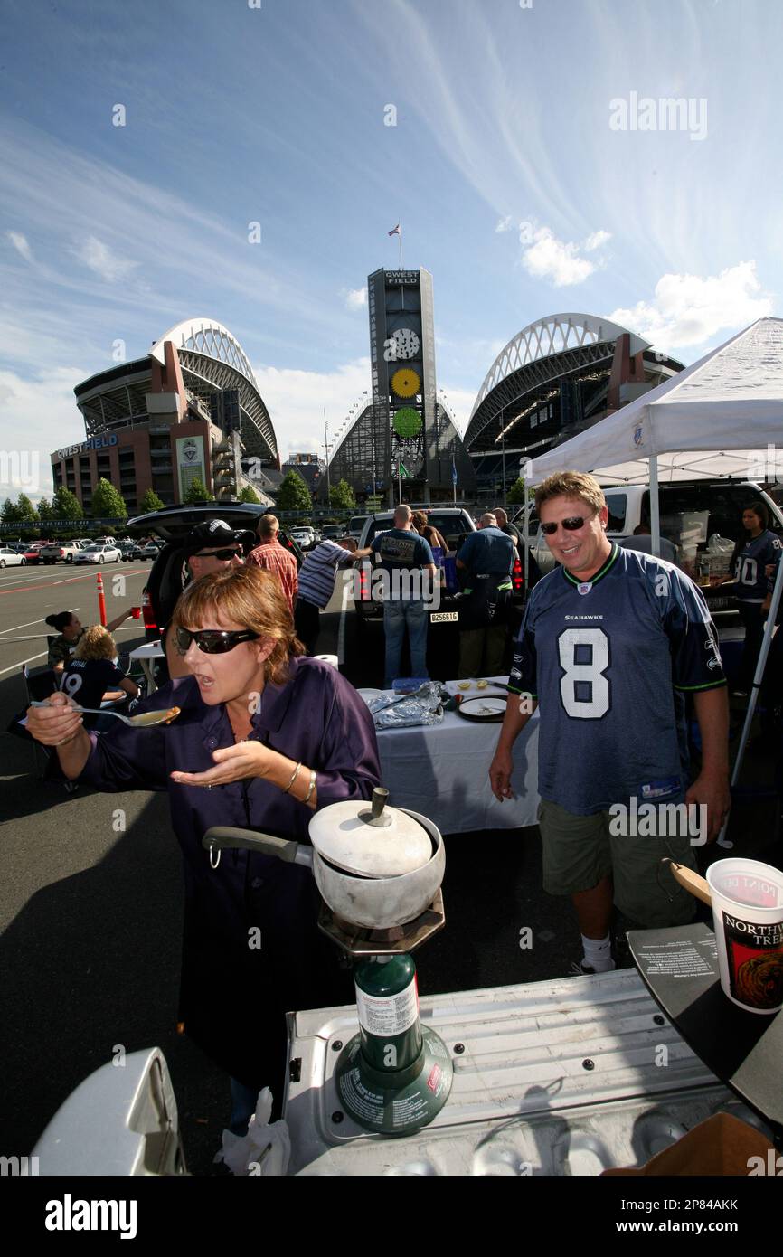 Tailgating Seattle Seahawks' fan Sara Quinton tastes the baked beans ...