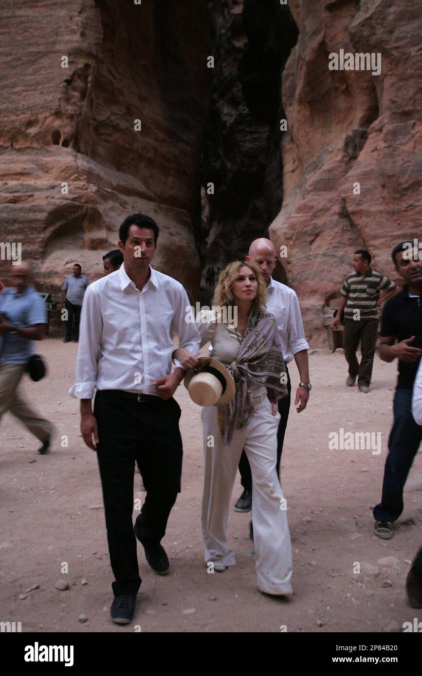 U.S. Pop star Madonna walks out from the Siq, an alley which leads to ...