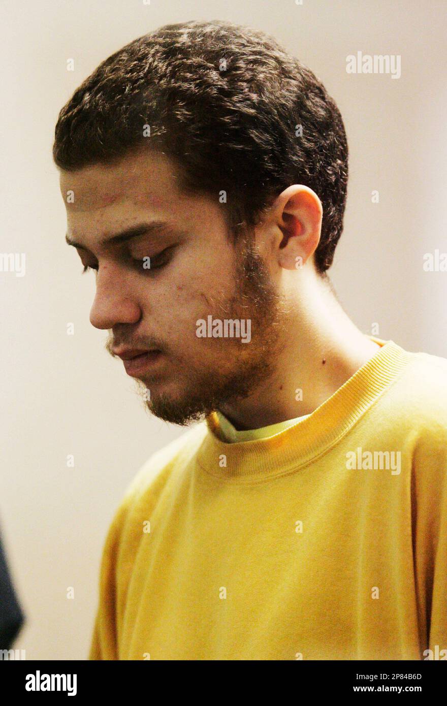 Alex Youshock, 17, appears behind a bullet proof glass in a Redwood ...