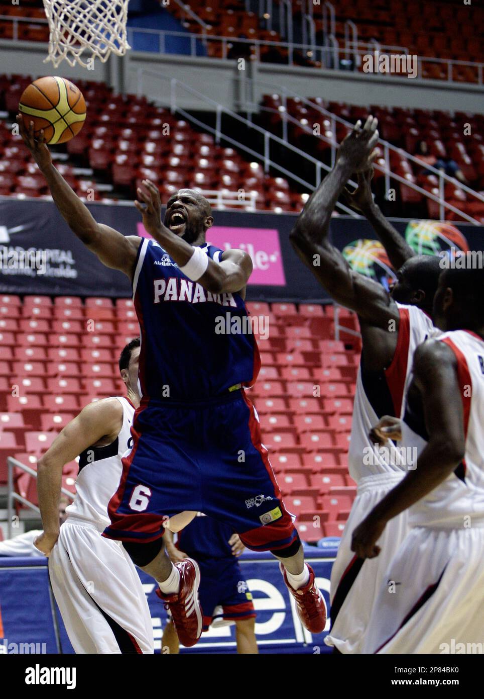 Panama's Danilo Pinnock, left, goes up for a layup as Canada's Joel ...