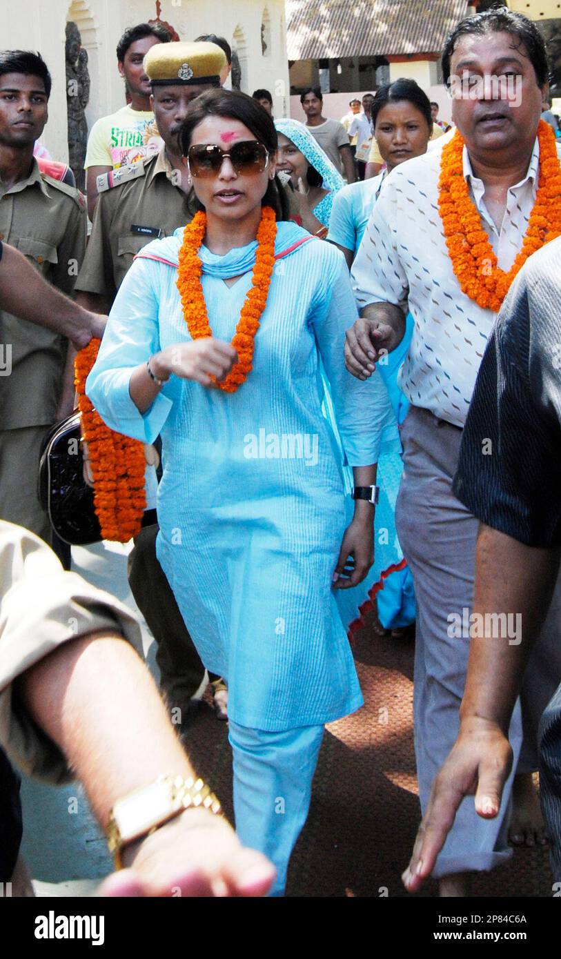 Bollywood actor Rani Mukherjee, center, with father Ram Mukherjee arrives to offer prayers at ...