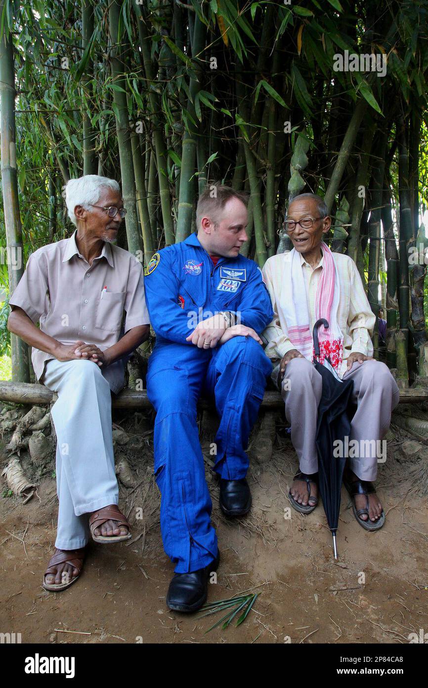 NASA astronaut Edward Michael "Mike" Fincke, center, interacts with ...