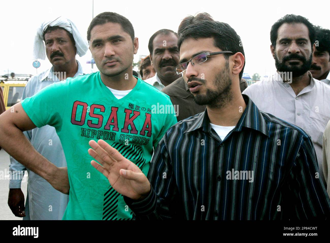 Pakistani student Rizwan Sharif, front right, who is deported with Umar ...