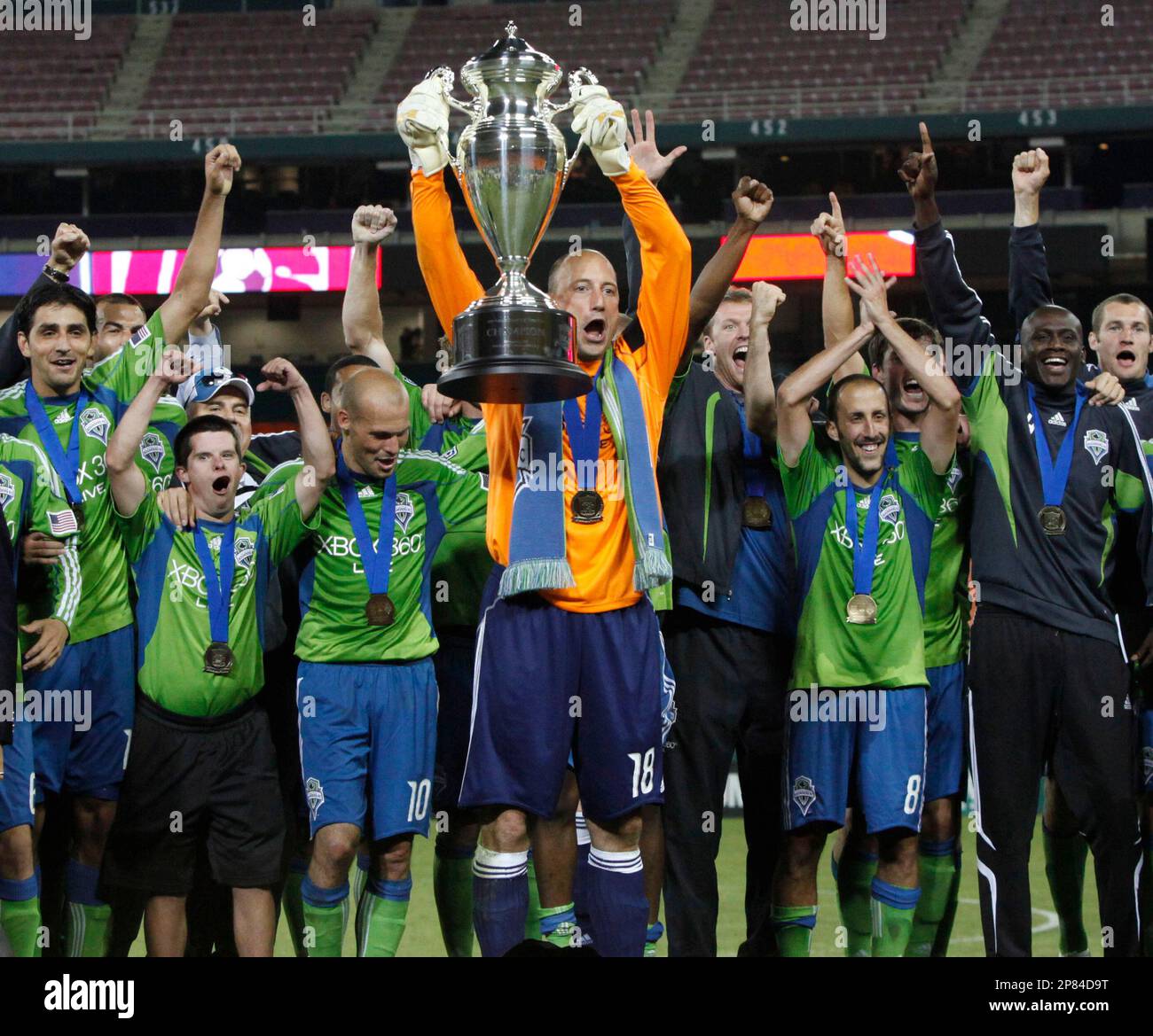 The Seattle Sounders soccer team celebrates after beating DC United 2-1 ...