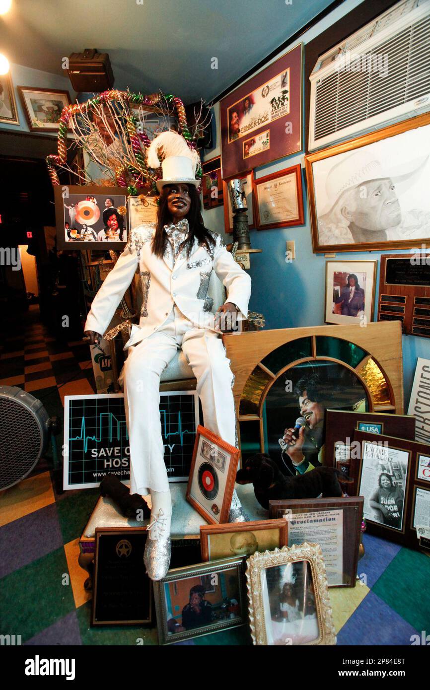 A life sized mannequin of Ernie K-Doe, dressed in a white suit, sits ...