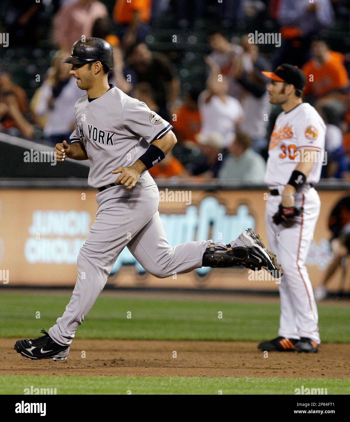 New York Yankees' Jorge Posada rounds the bases after hitting a home ...