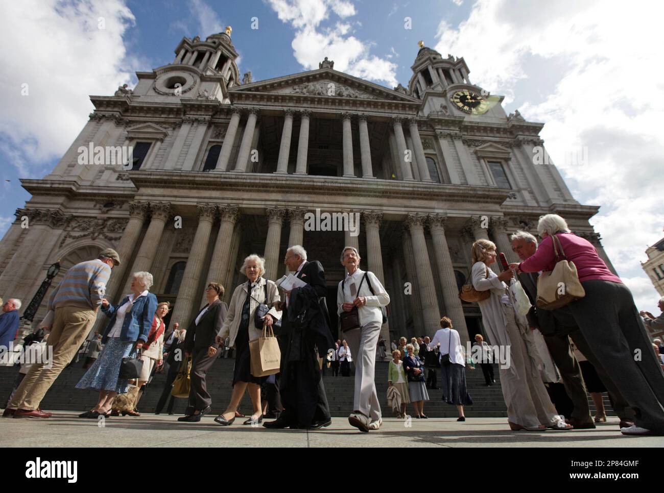 British former evacuees, some wearing their handwritten badges with ...