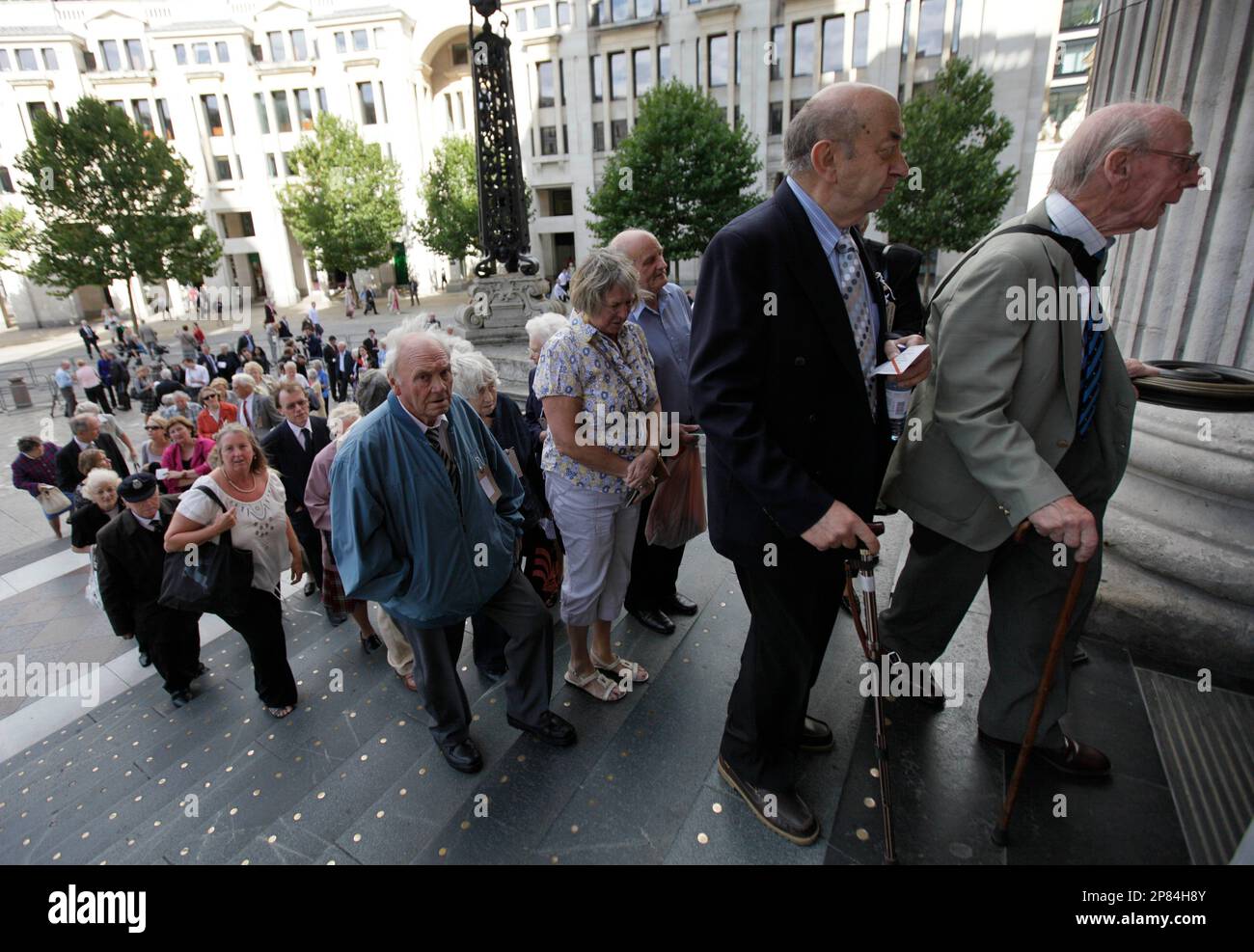 British evacuees, some wearing their handwritten badges with ...