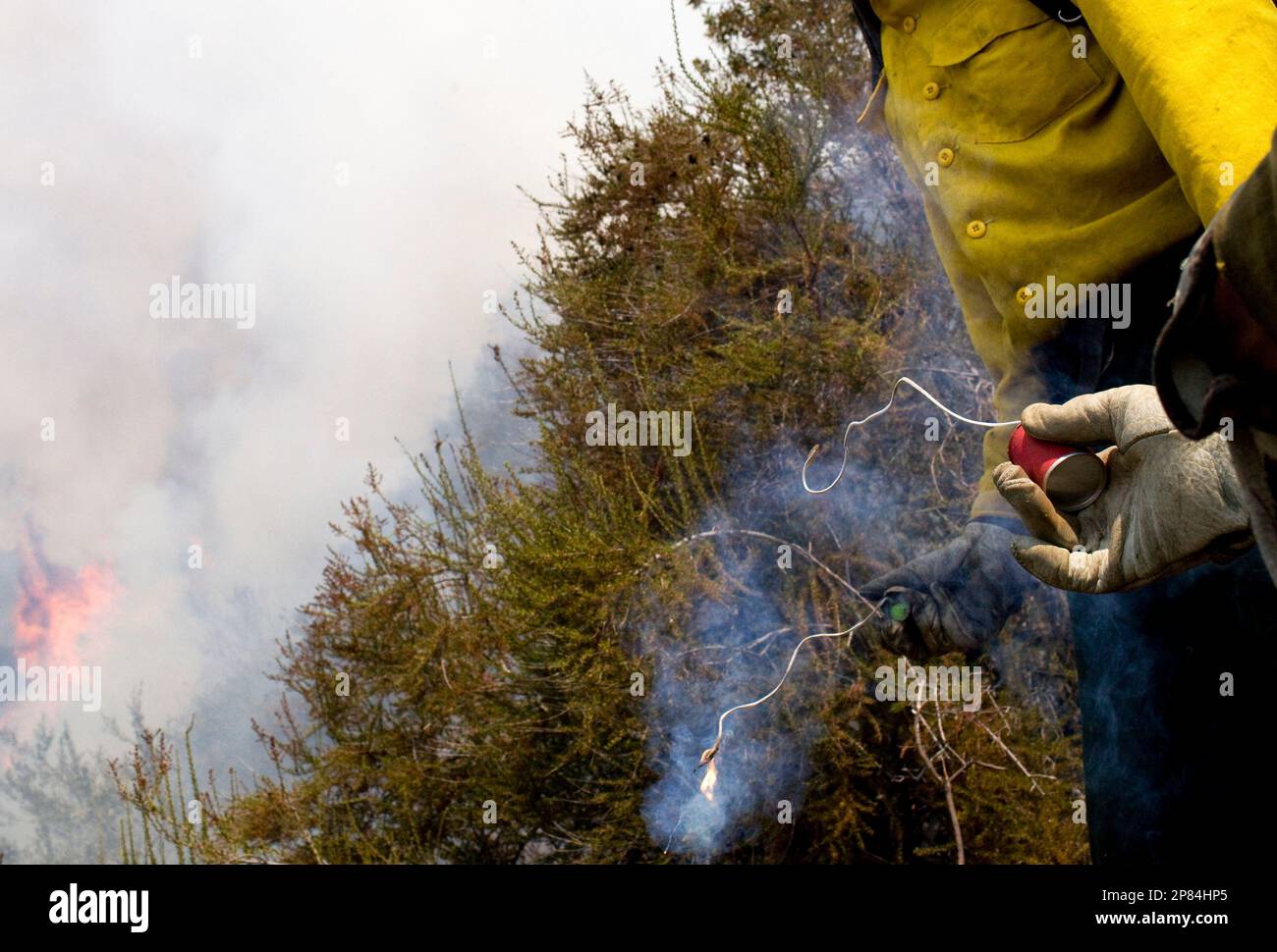Hotshot firefighters light incendiary devices while deliberately ...