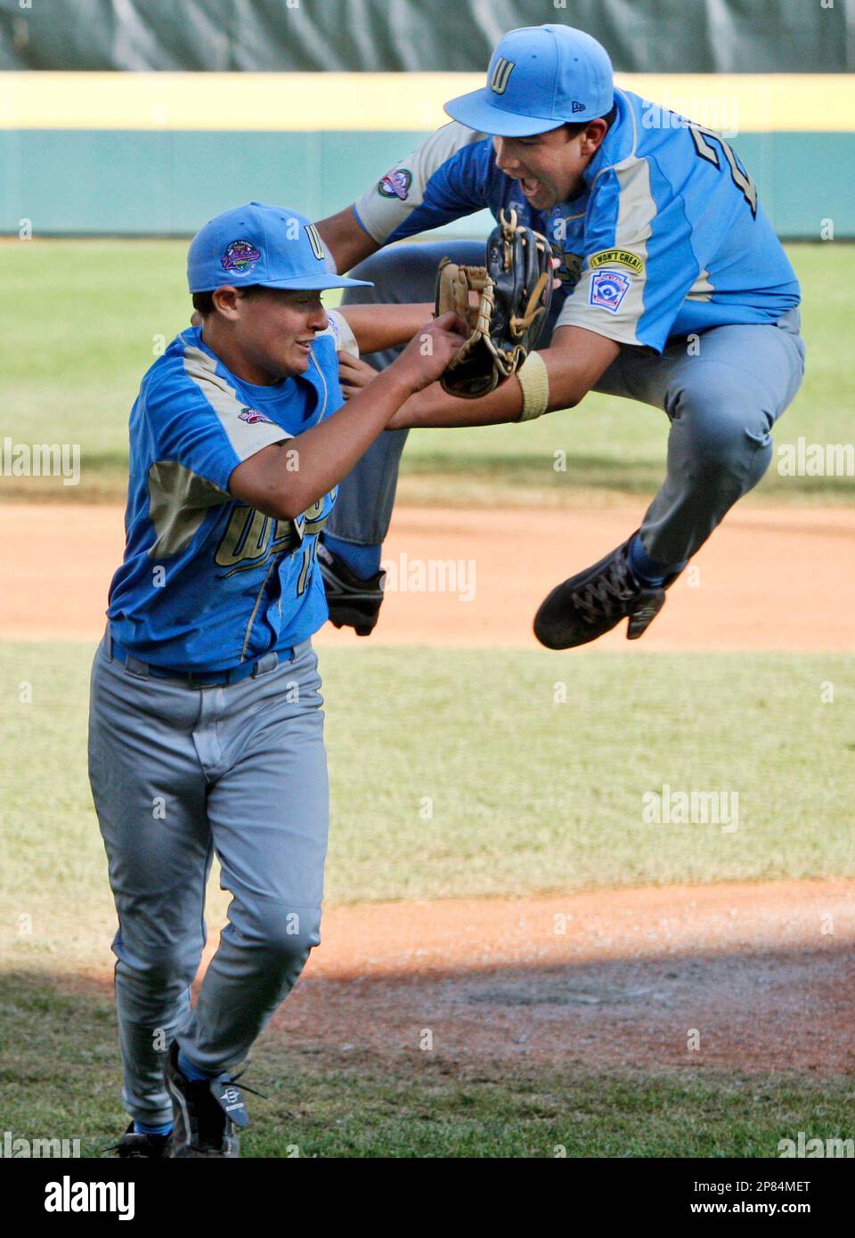 Chula Vista, Calif., first baseman Luke Ramirez, right, celebrates with ...