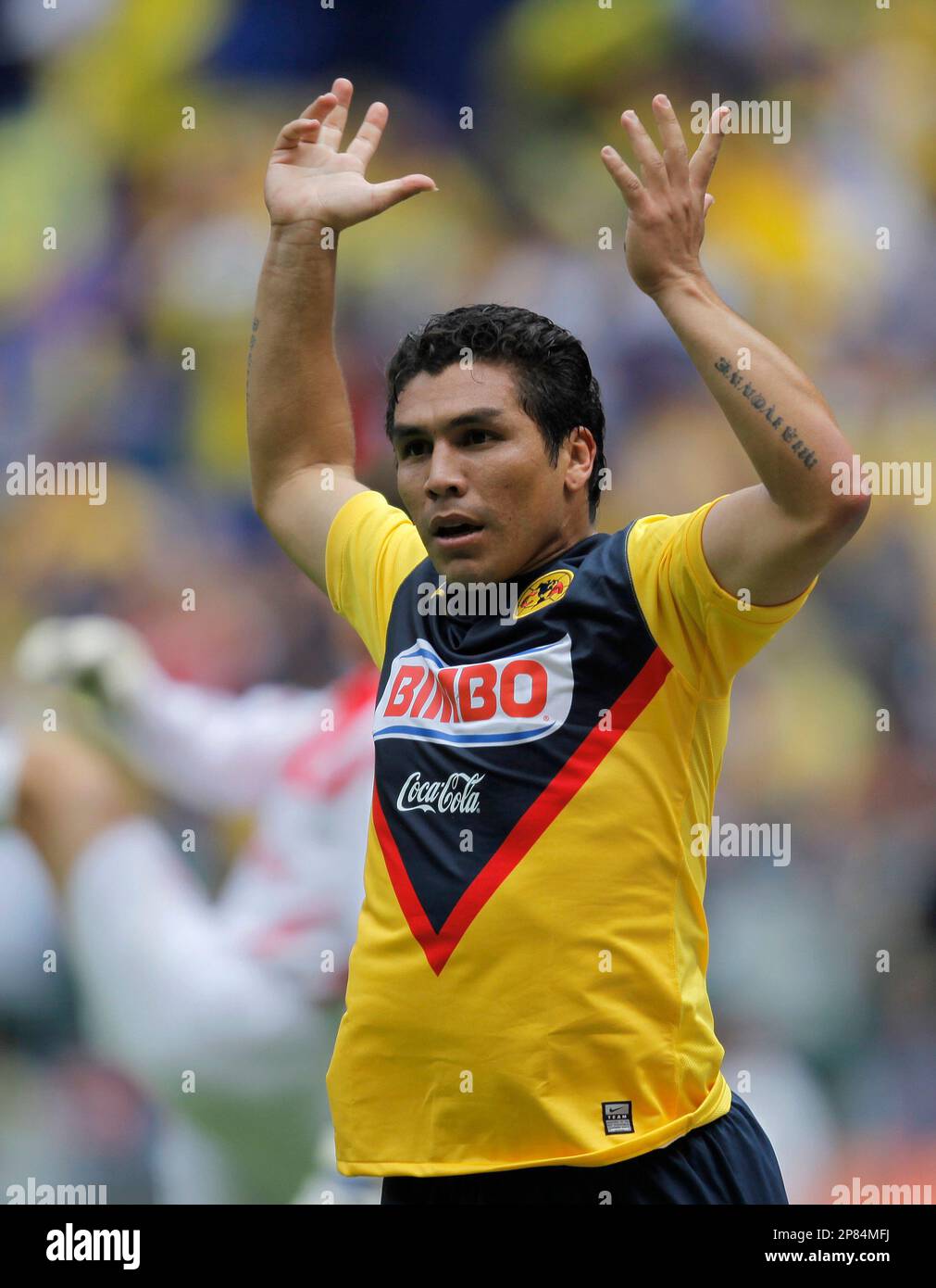 America's Salvador Cabanas, center, of Paraguay, celebrates after ...