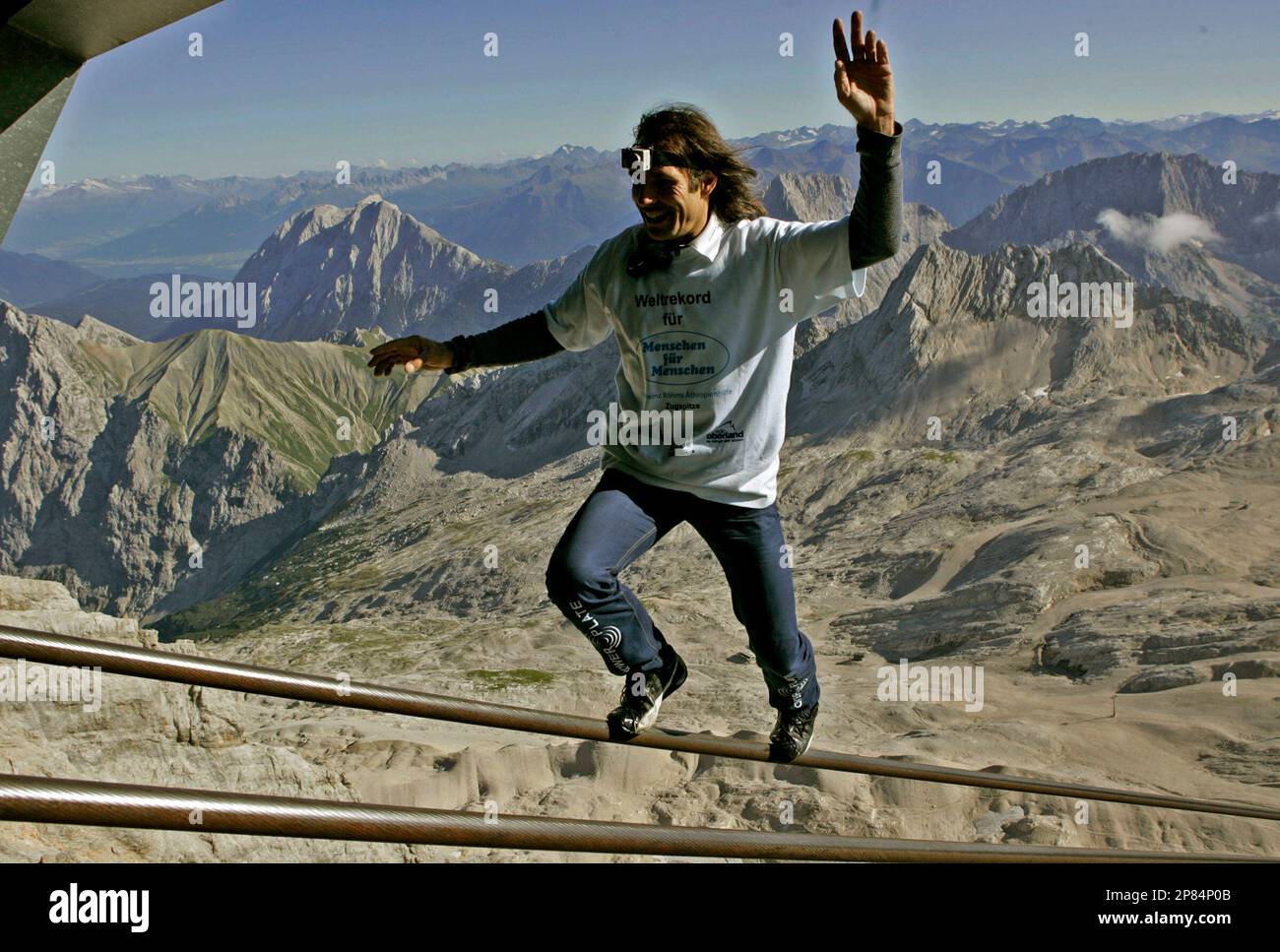 Swiss tightrope walker Freddy Nock balances on the 995-meter-long cable ...