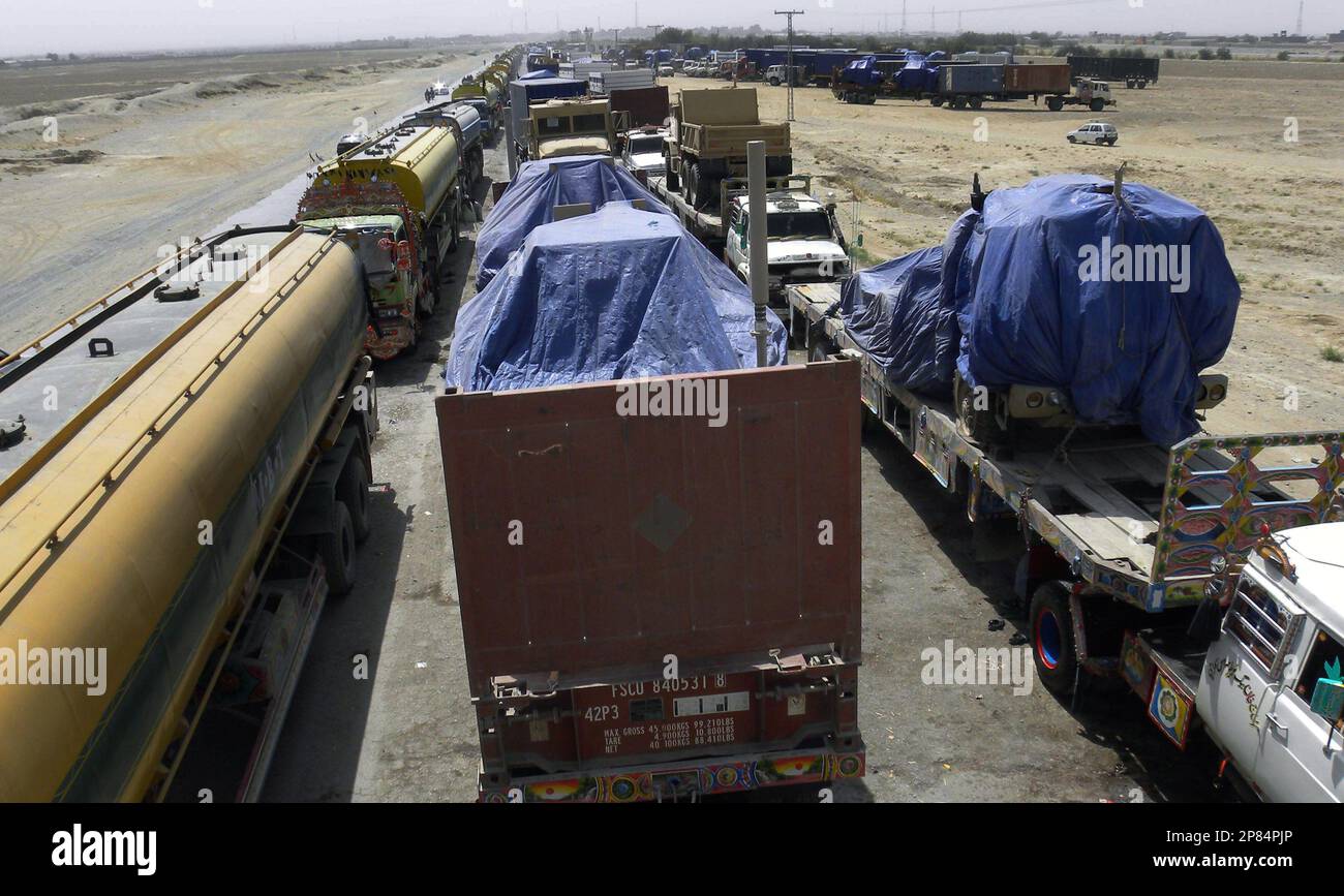 Pakistani trucks carrying supplies for NATO forces wait for the border ...