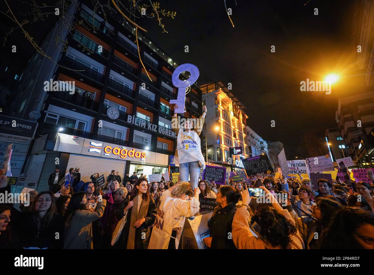 Ankara, Turkey. 08th Mar, 2023. A woman stands on a trash can and ...
