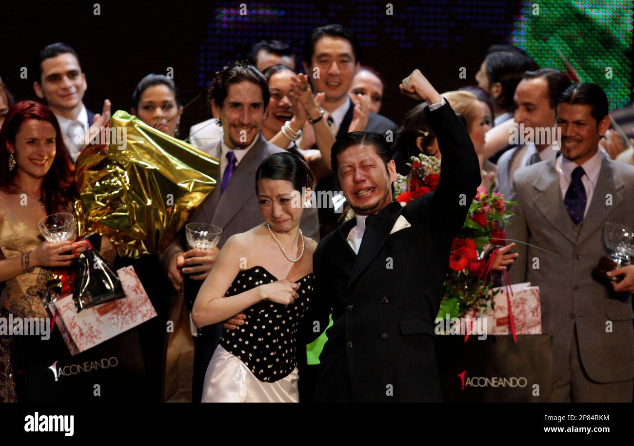 Hiroshi Yamao, right, and Kyoko Yamao, from Japan celebrate winning the ...