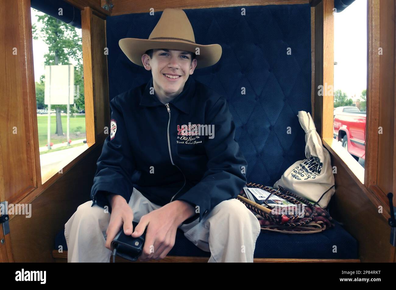 Alex Good, 18, from Grand Rapids, sits in his parent's 1848 stage coach ...