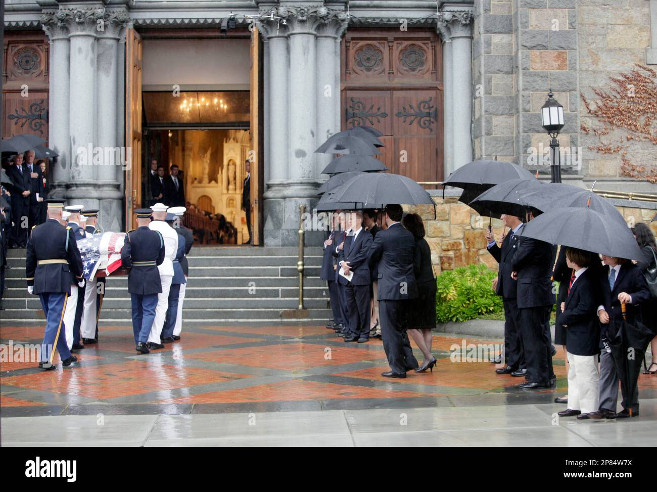 The casket of Sen. Edward Kennedy is carried into Our Lady of Perpetual ...