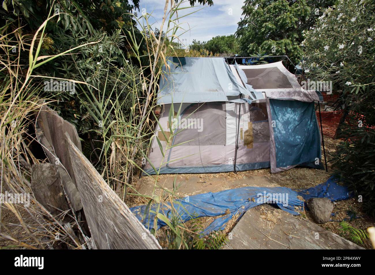 A tent is set up the far backyard of a home in Antioch, Calif., Friday ...