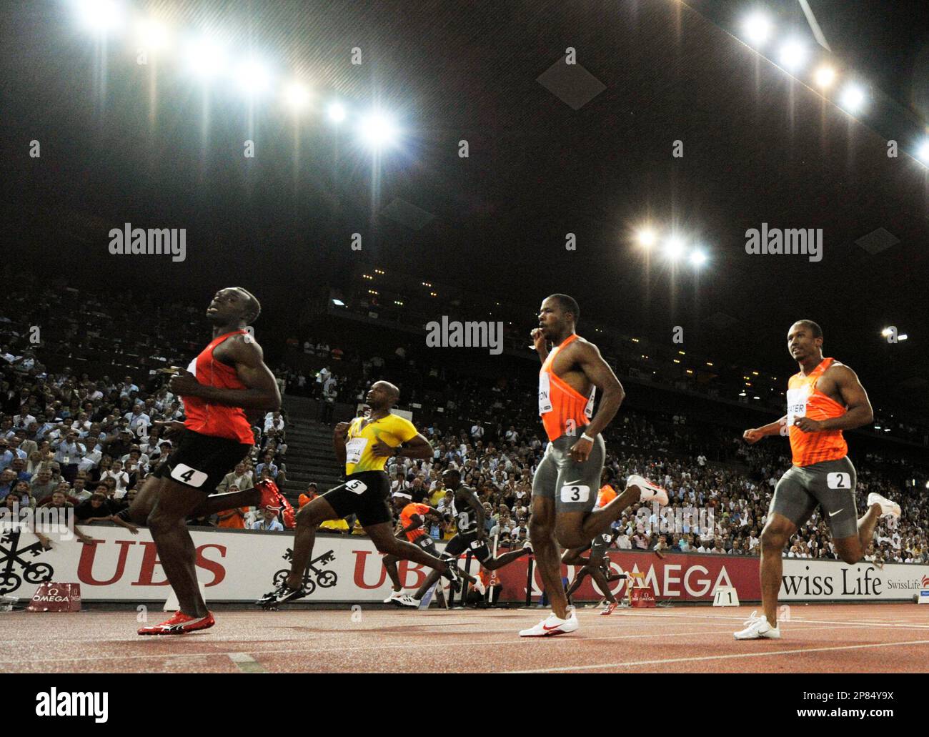 Jamaican Usain Bolt, left, runs to win the men's 100 meter race ahead of Jamaican Asafa Powell ...