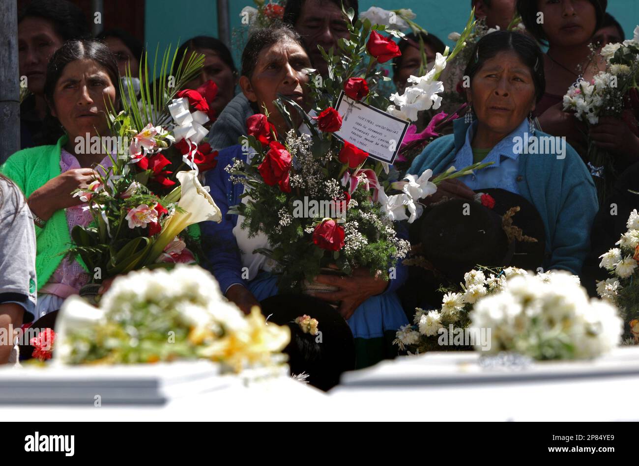 Andean Indigenous women attend a ceremony for the victims of a 1984 ...