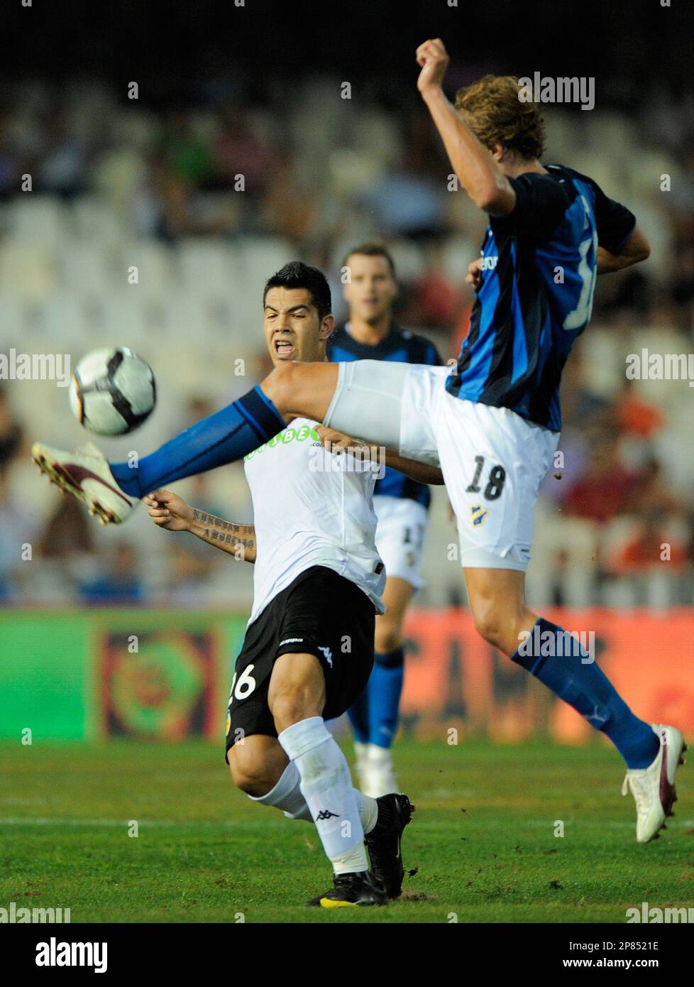Valencia's Miku Fedor from Venezuela, left, duels for the ball with ...