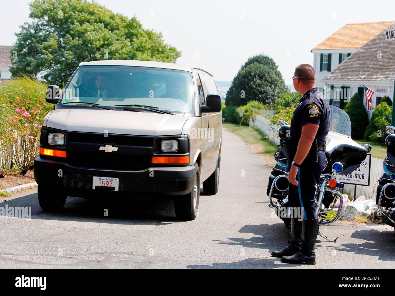 A van with black tape over a portion of the license plate leaves the ...