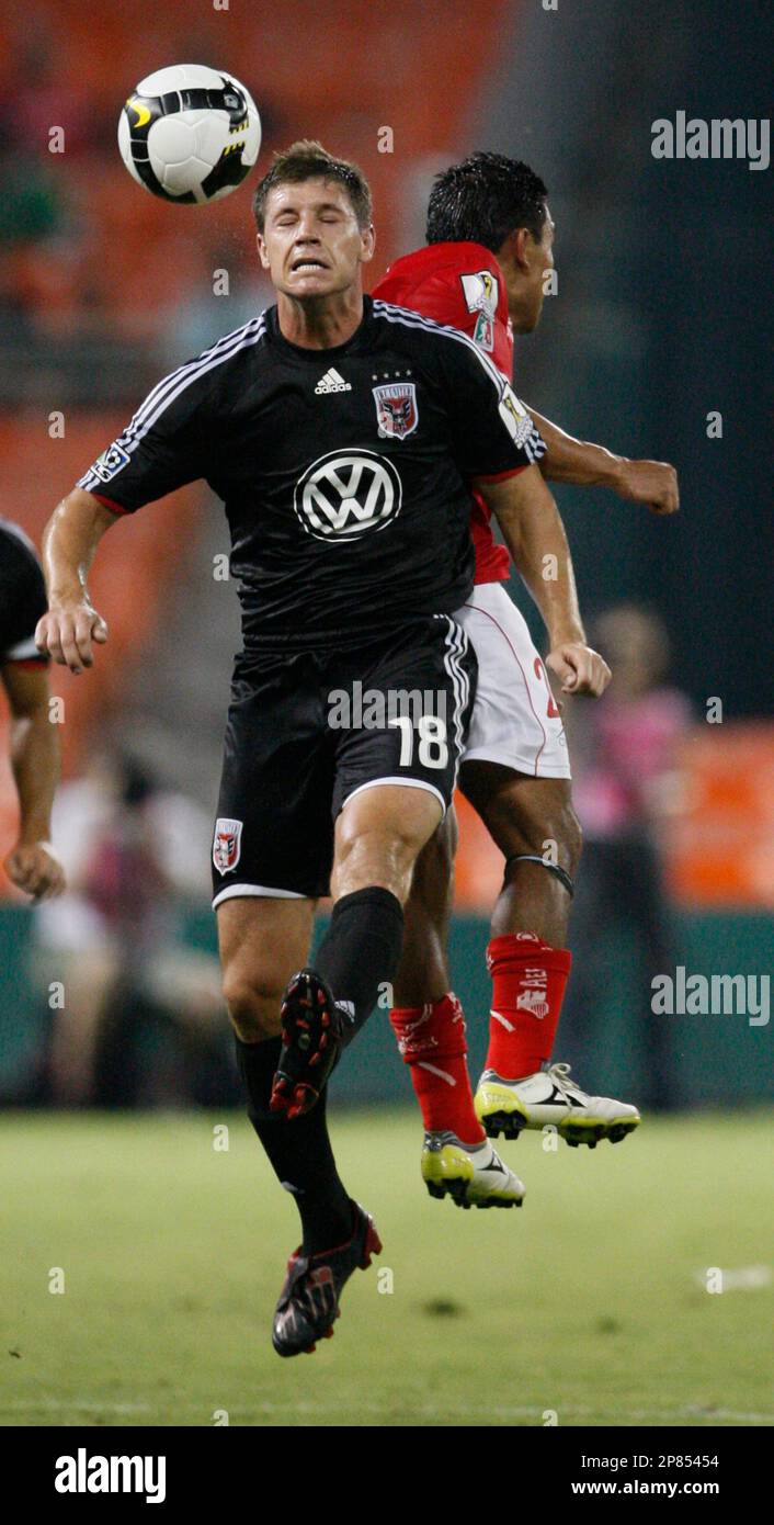 DC United's Devon McTavish heads the ball as he battles with Manuel ...