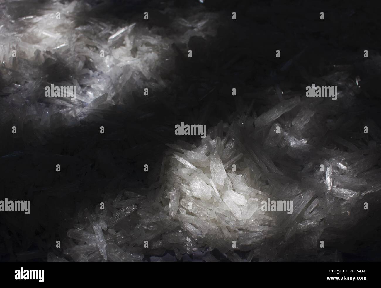Crystal methamphetamine dries on a table at a seized illegal laboratory ...
