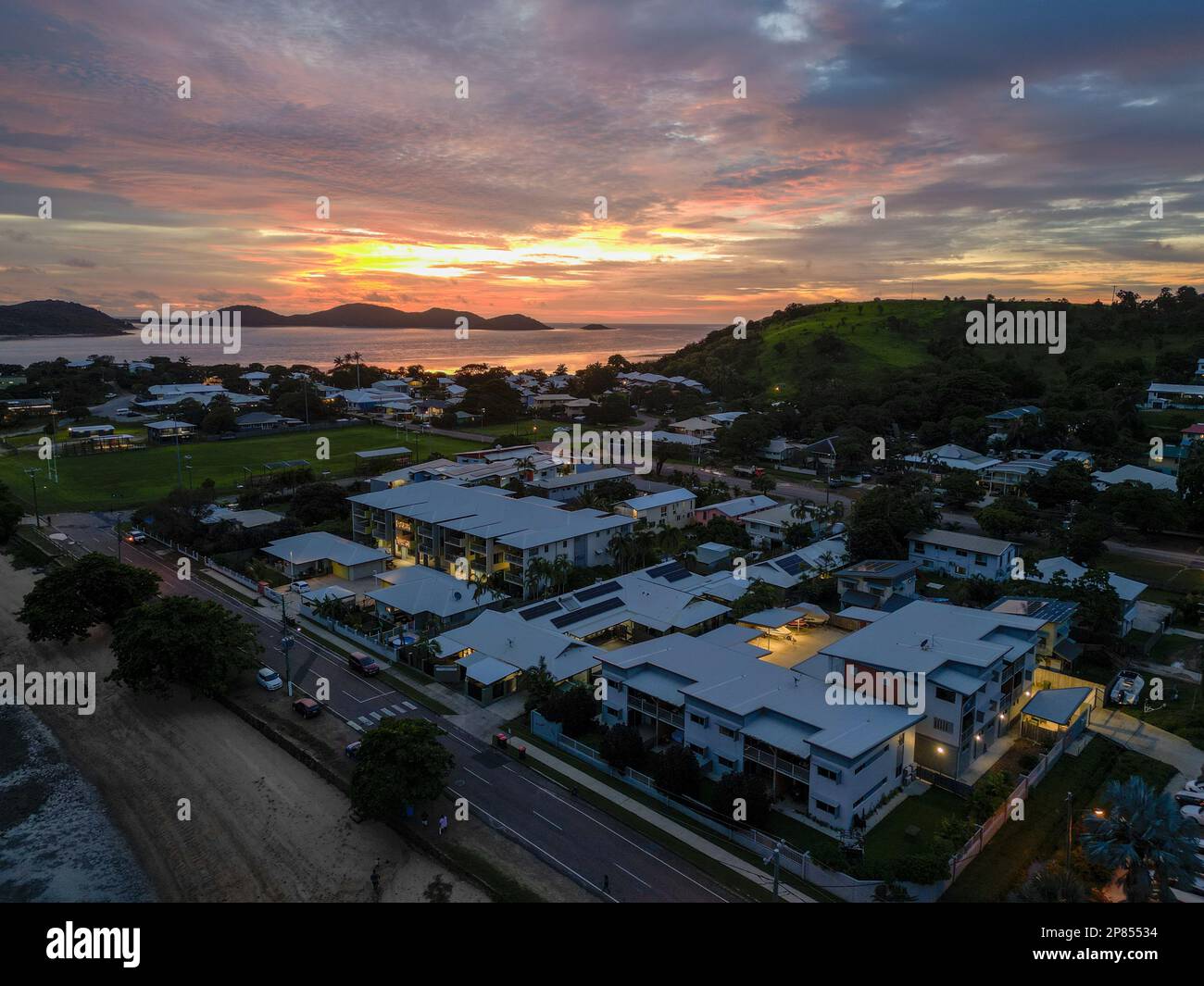 Aerial orange sunset showing the beach and town of Torres Strait Stock ...