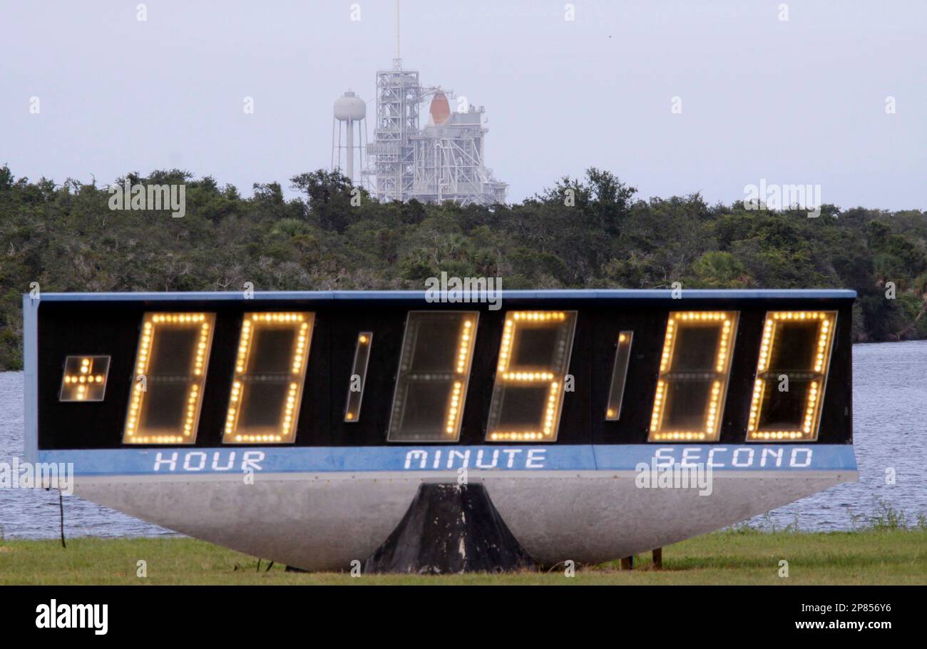 The countdown clock has stopped as Space Shuttle Discovery is seen at a ...