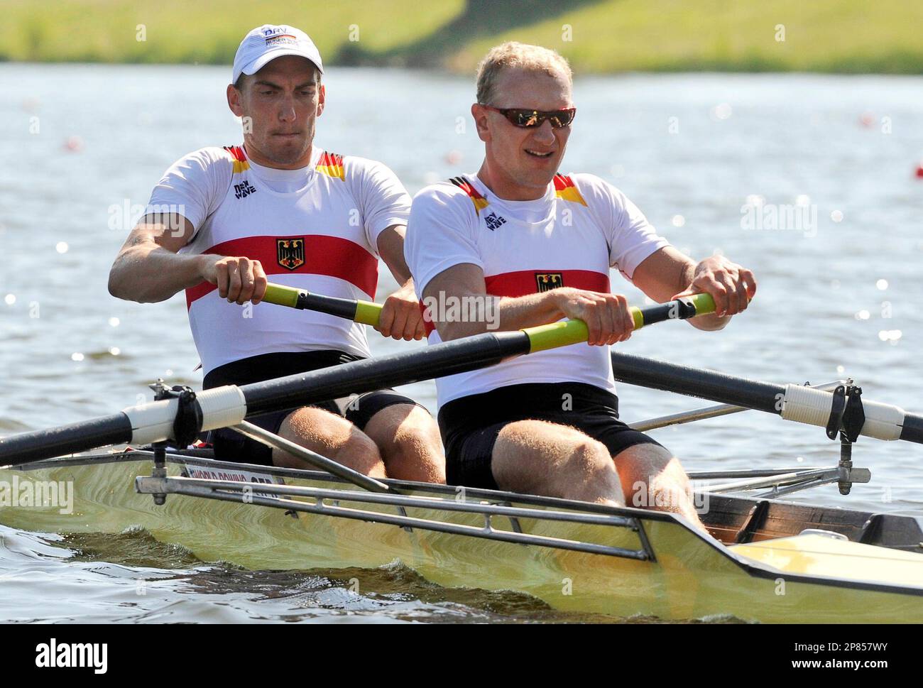 Germany's Tim Berent, not seen, Florian Eichner, left, and Philipp ...