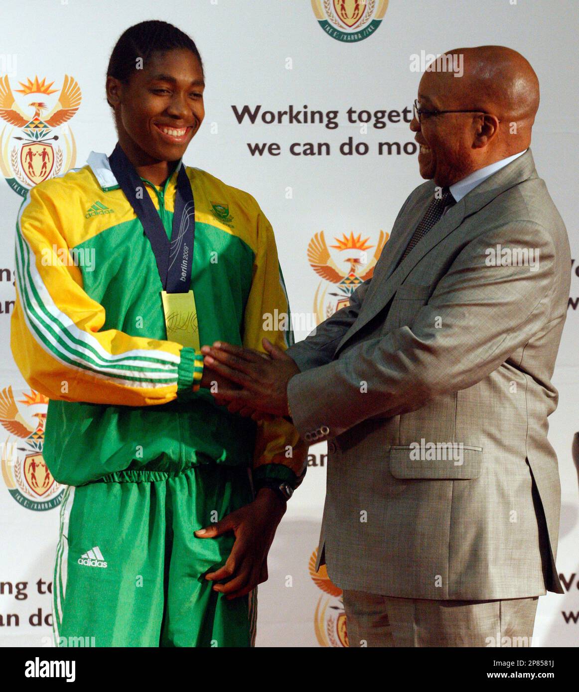 South Africa's President Jacob Zuma, right, congratulates athlete ...