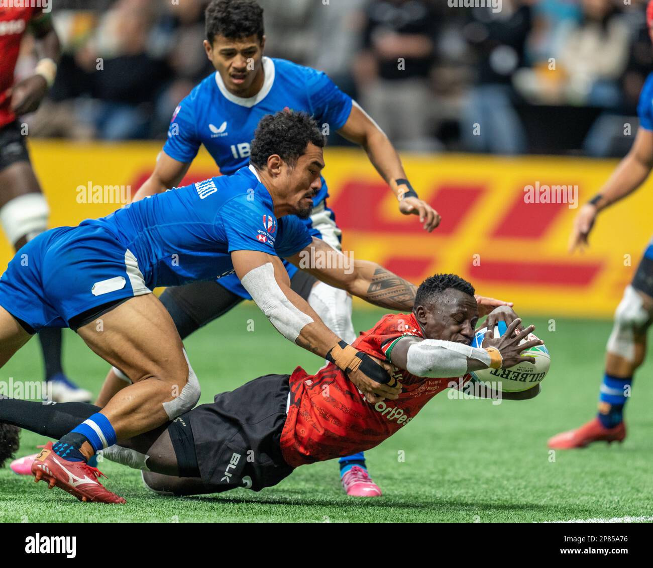 Vancouver, Canada. 5th March, 2023. Brian Tanga of Kenya (R) dives in ...