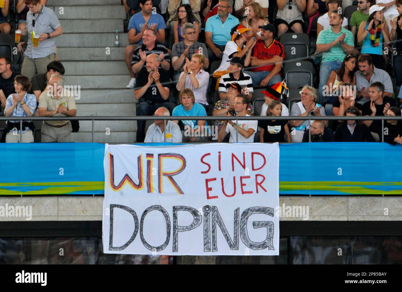 German spectators display a banner that translates to 'We are your ...
