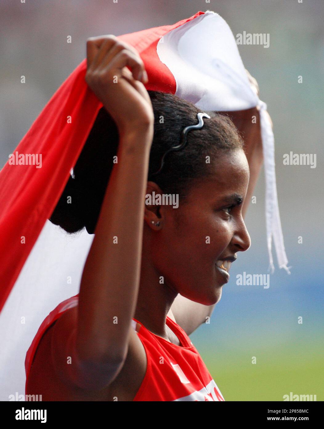 Maryam Yusuf Jamal of Bahrain celebrates after placing second in the ...