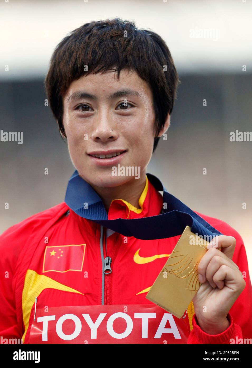 China's Bai Xue poses with her gold medal during the medal ceremony for ...