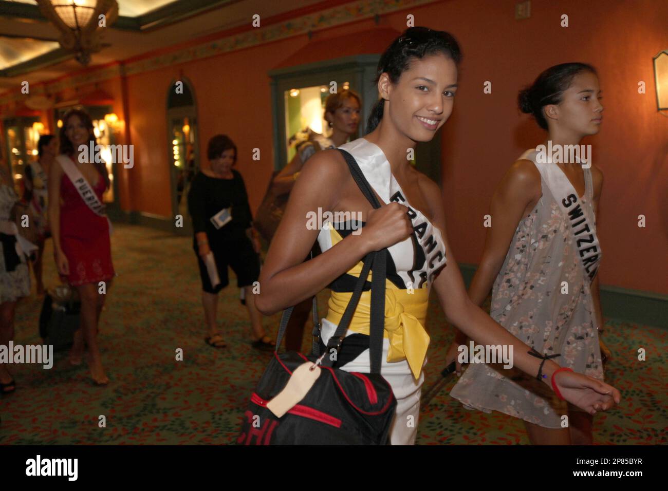 Miss France Chloe Mortaud, center, Miss Switzerland Whitney Toyloy ...