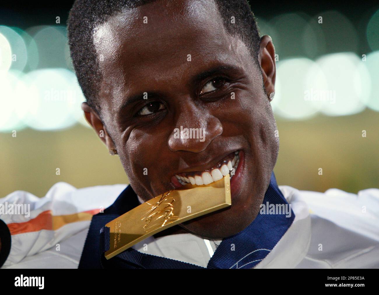 United States' Dwight Phillips poses with his gold medal during the ...