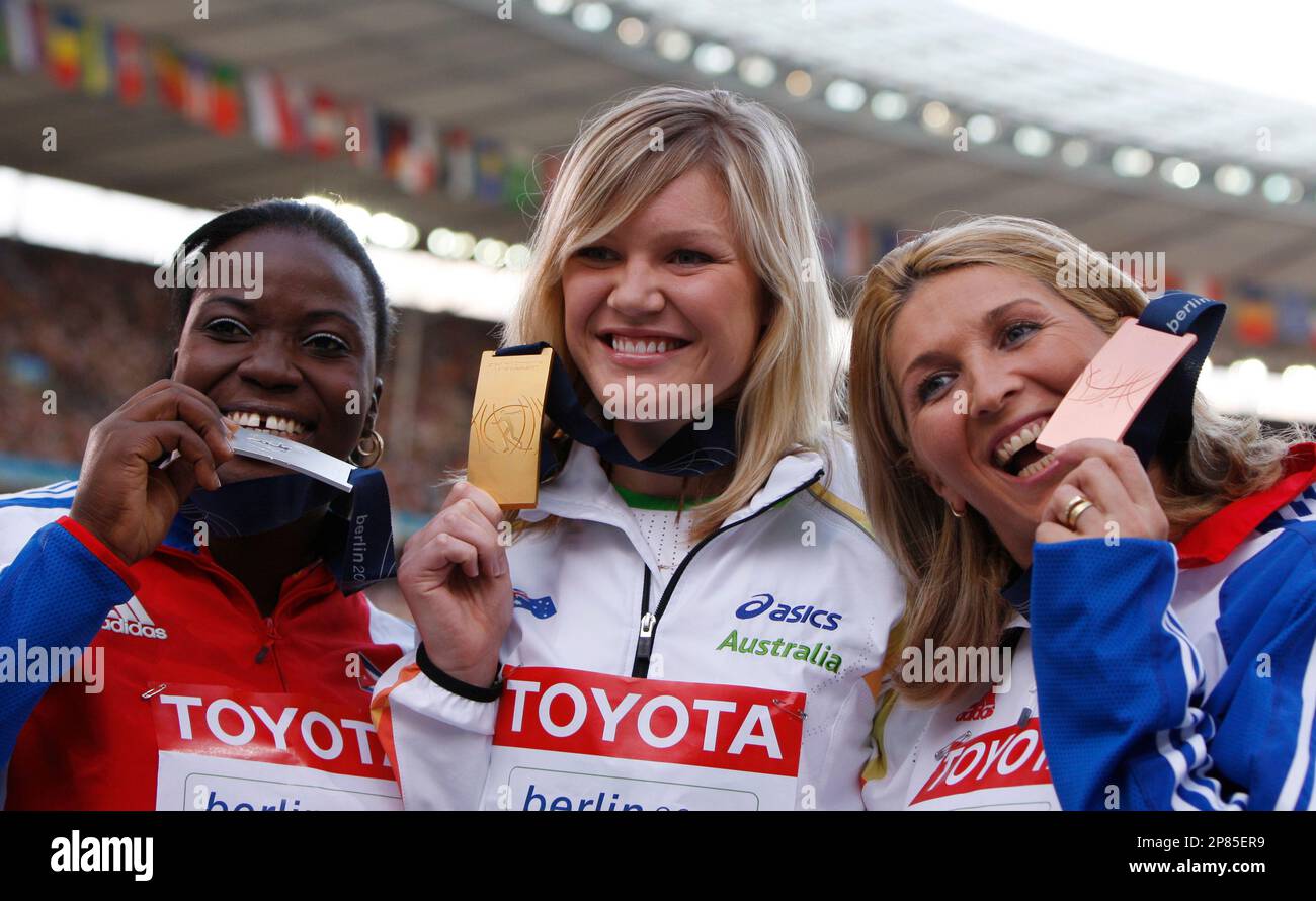 Gold medal winner Dani Samuels of Australia is flanked by silver medal ...