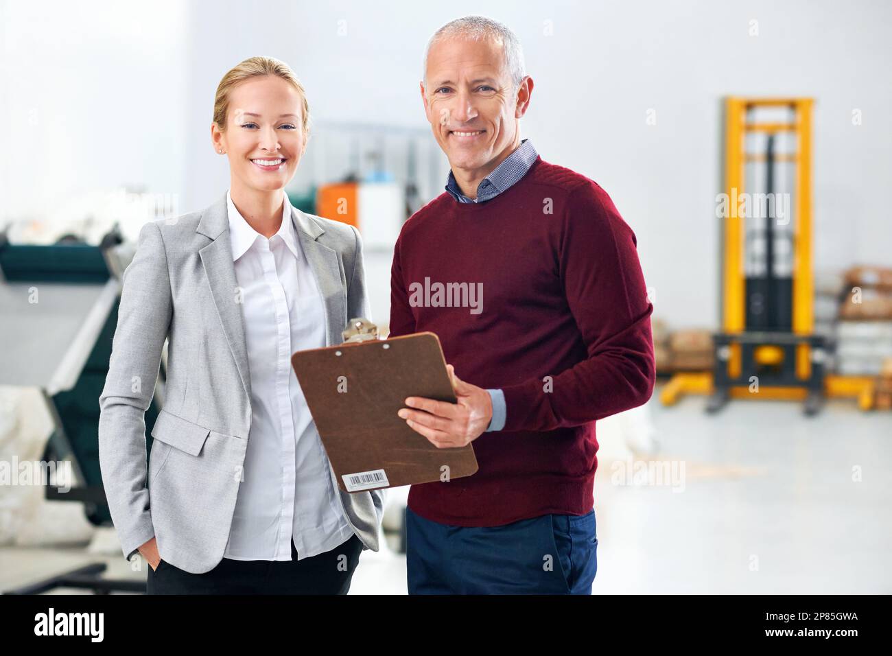 Managing the factory with poise and confidence. two warehouse managers ...
