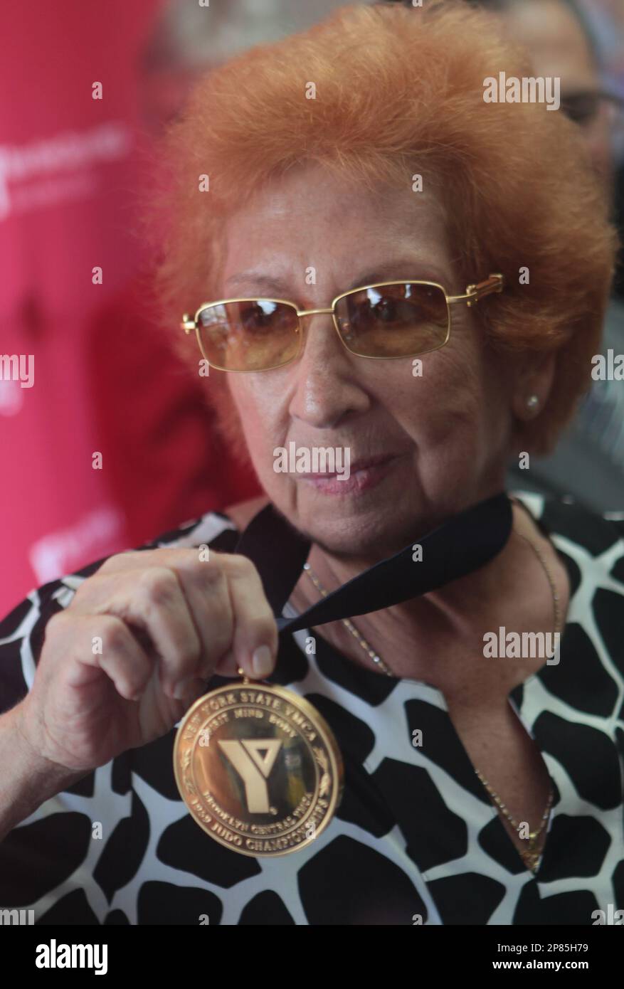 Rena "Rusty" Kanokogi shows her winning gold medal for the 1959 New ...