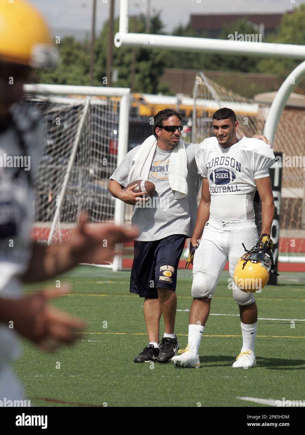 Fordson High School wide receiver Baquer Sayed, right, talks with ...